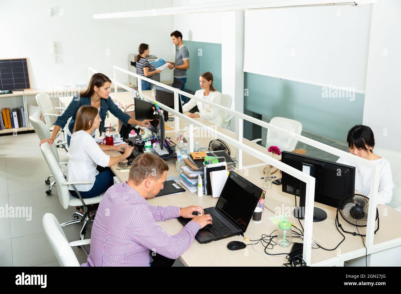 People working with computers and laptops in modern office Stock Photo ...