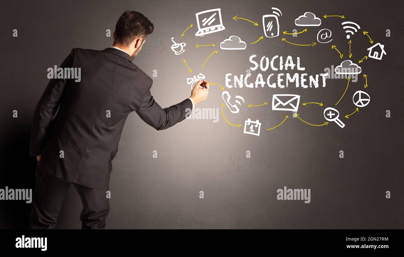 businessman drawing social media icons Stock Photo - Alamy