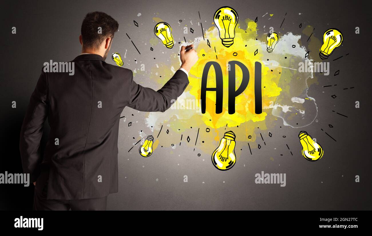 man drawing colorful light bulb Stock Photo - Alamy