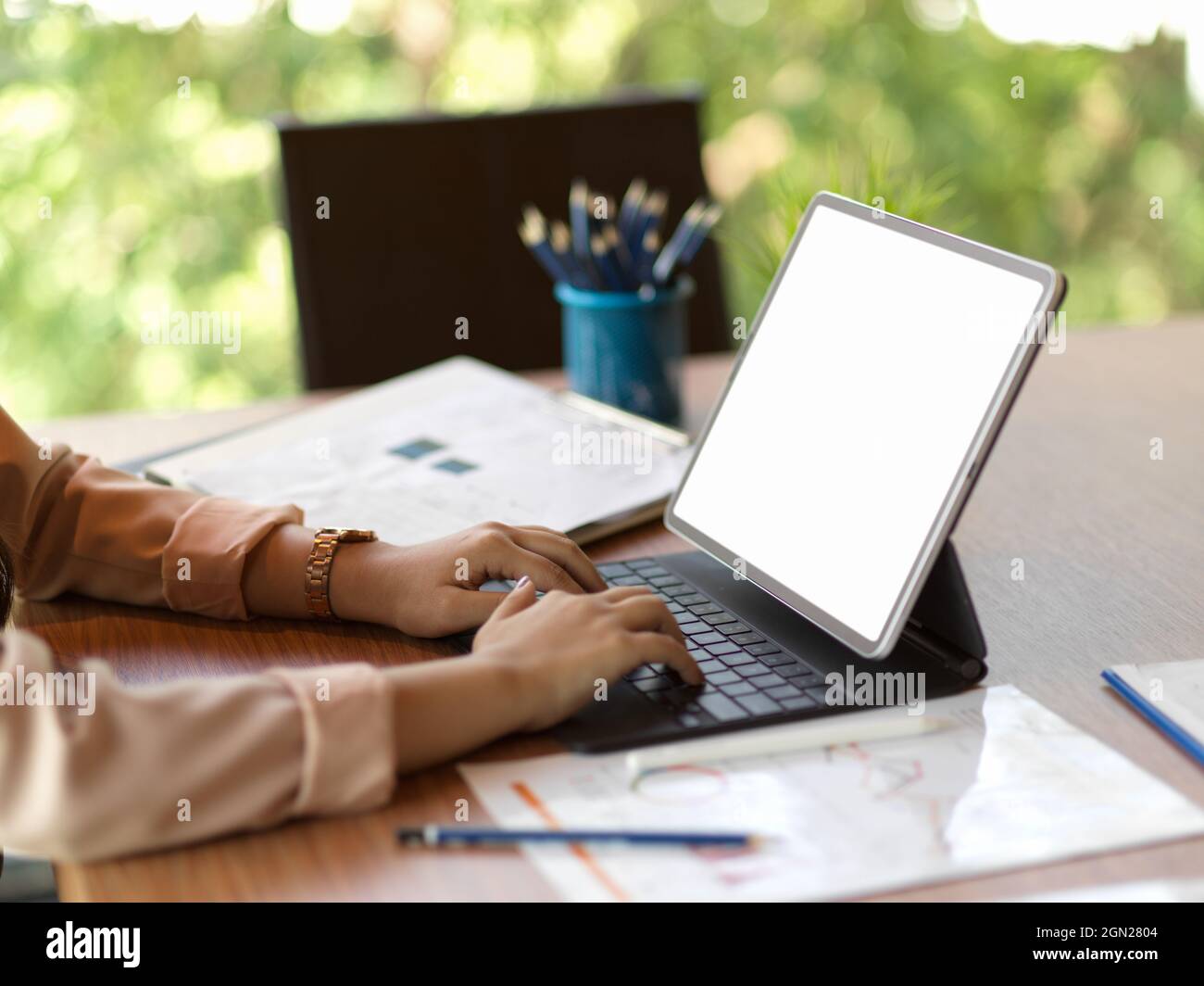 Success executive female typing working on portable tablet keyboard in ...