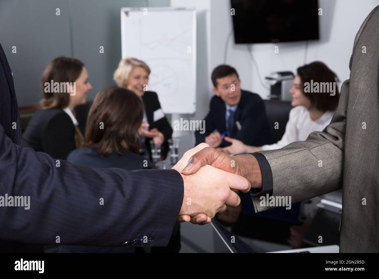 Closeup of international handshake Stock Photo - Alamy