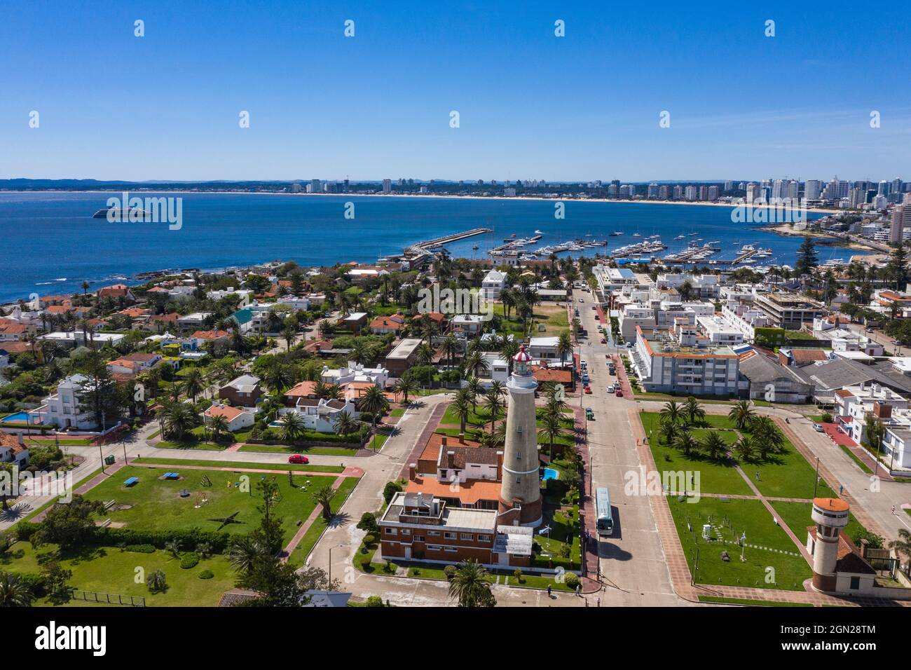 Aerial view of Faro de Punta del Este lighthouse with city and ...