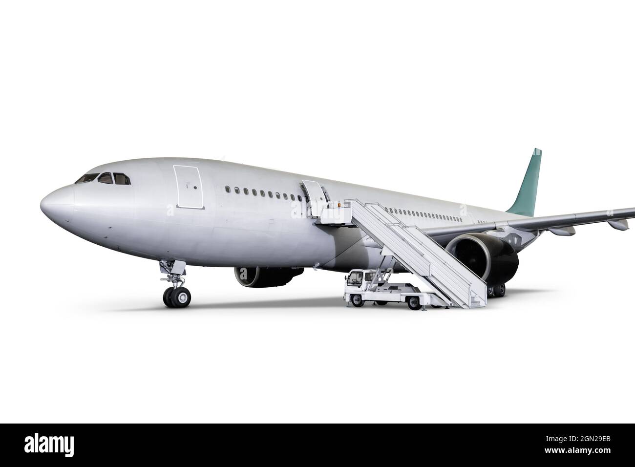 Wide body passenger airliner with air-stairs at the airport apron ...