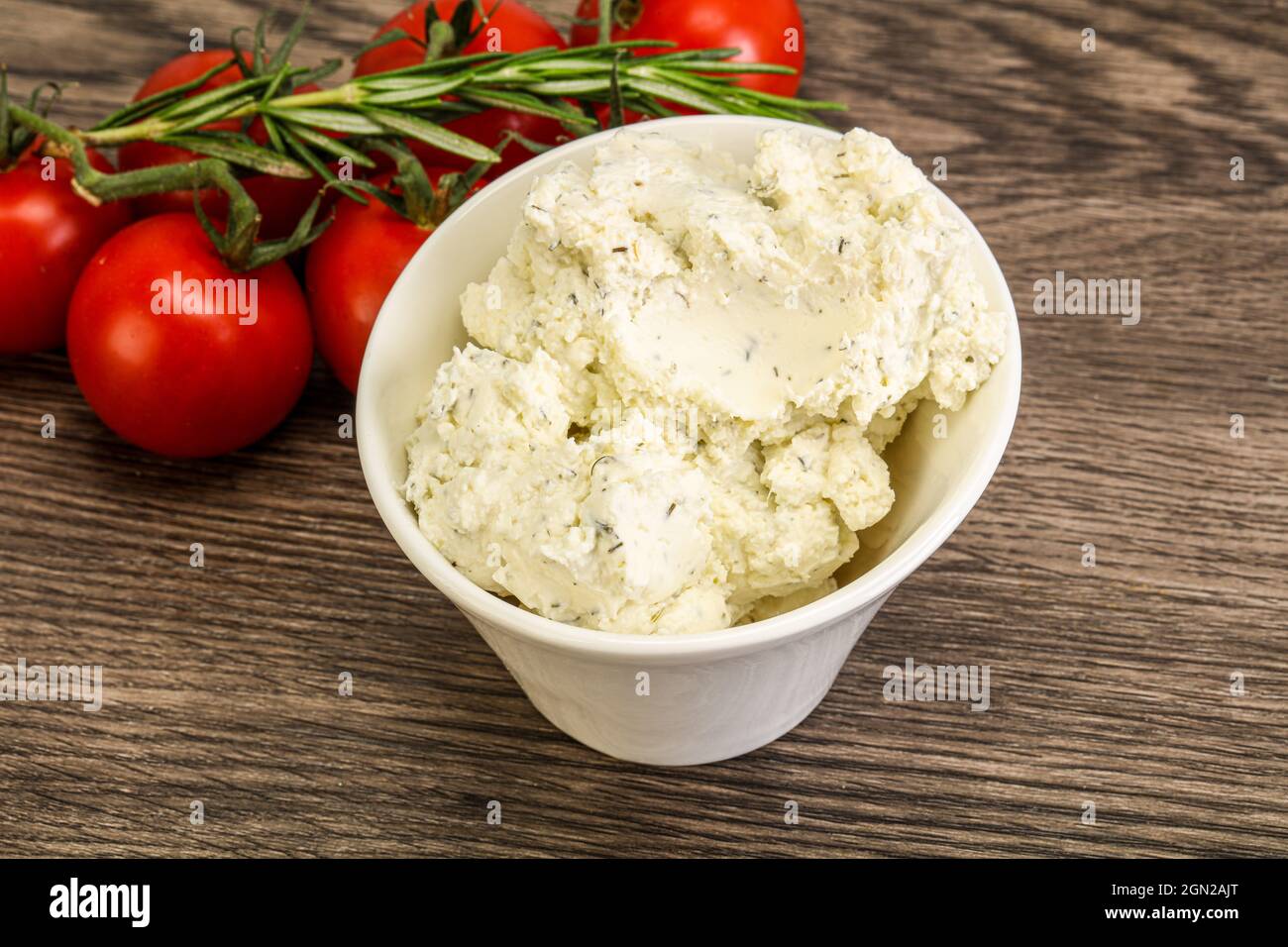 Soft cream cheese with herbs in the bowl Stock Photo - Alamy