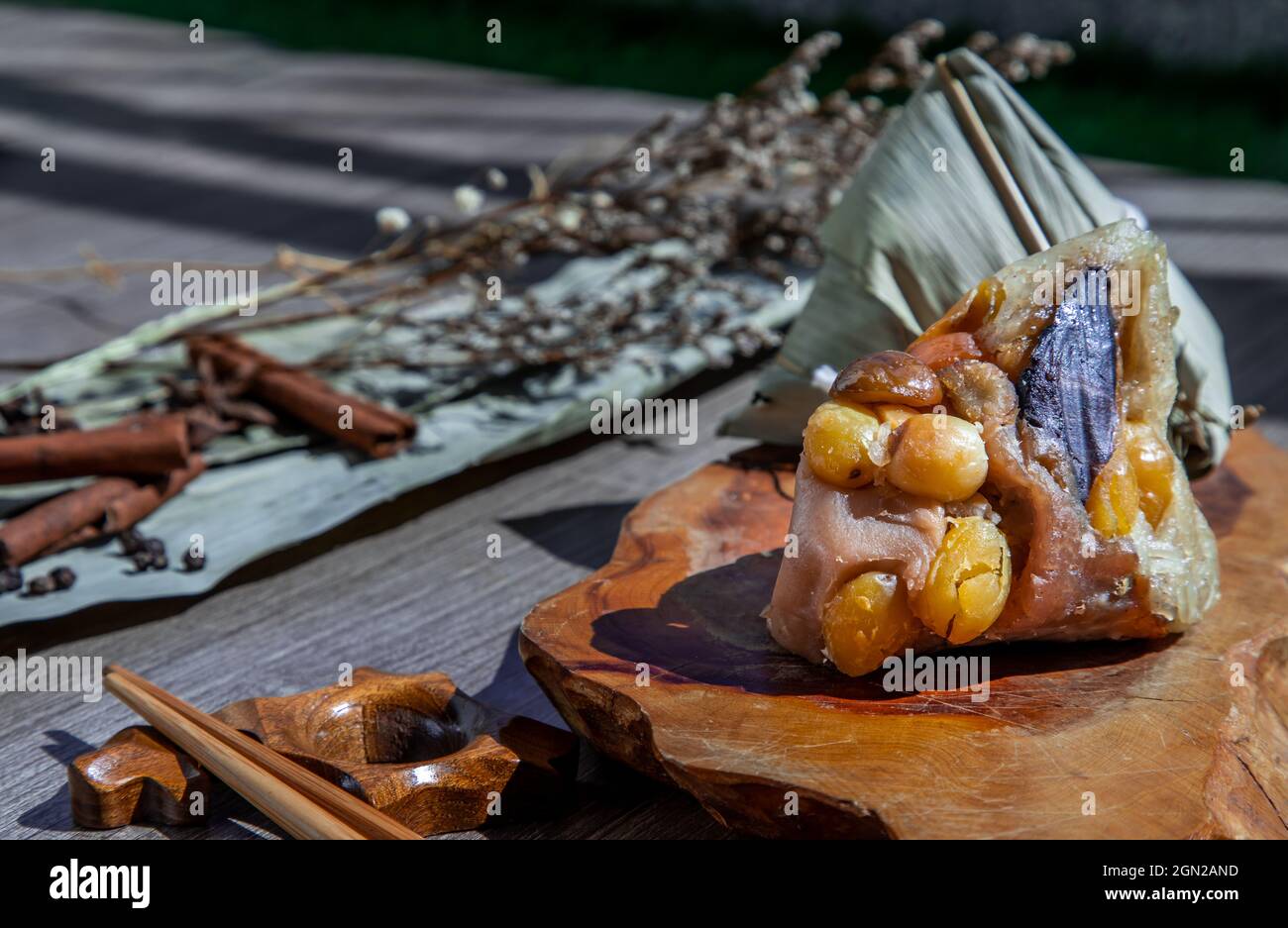 Chinese rice dumpling (Zongzi) shaped pyramidal wrapped by leaves ...