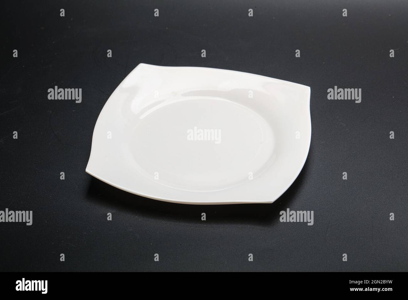 White empty plate for serving isolated Stock Photo - Alamy