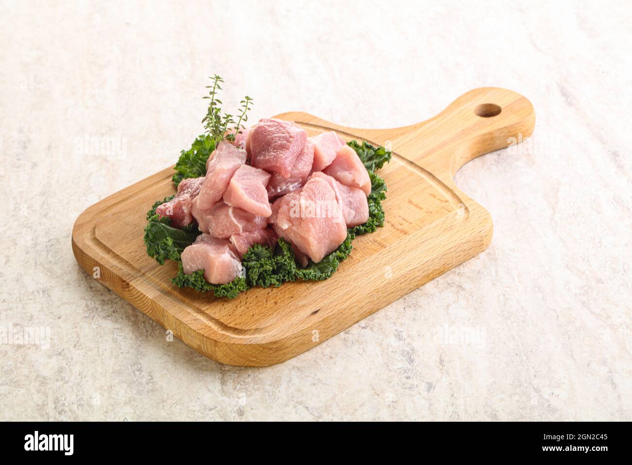 Raw pork meat cubes for coocking over board Stock Photo - Alamy