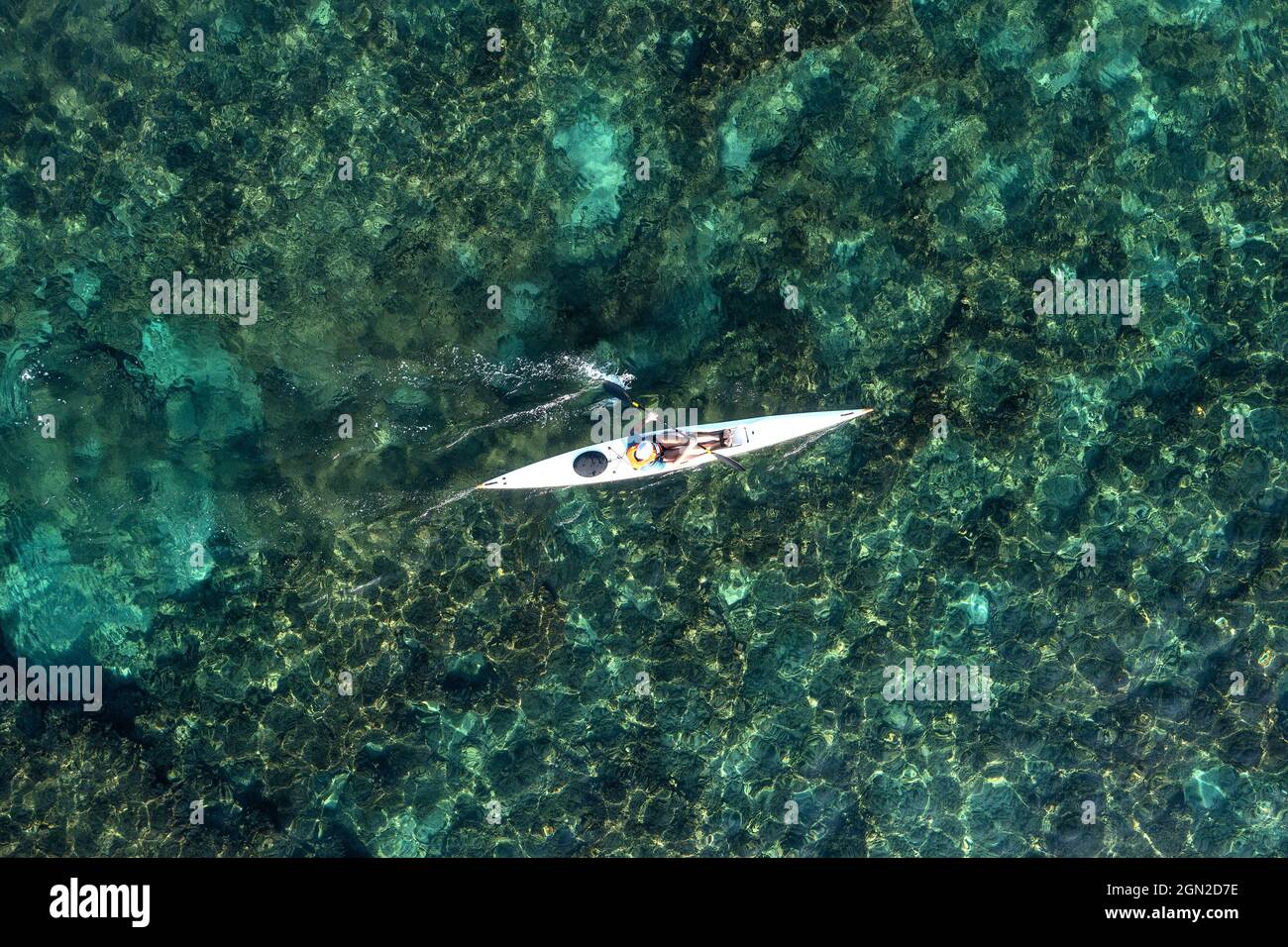 Single seat canoe rowing over a shallow lagoon, Aerial view Stock Photo ...