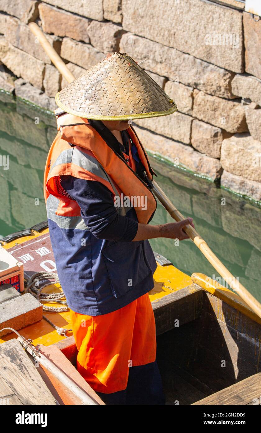 Workman along the canal in Suzhou, China Stock Photo - Alamy