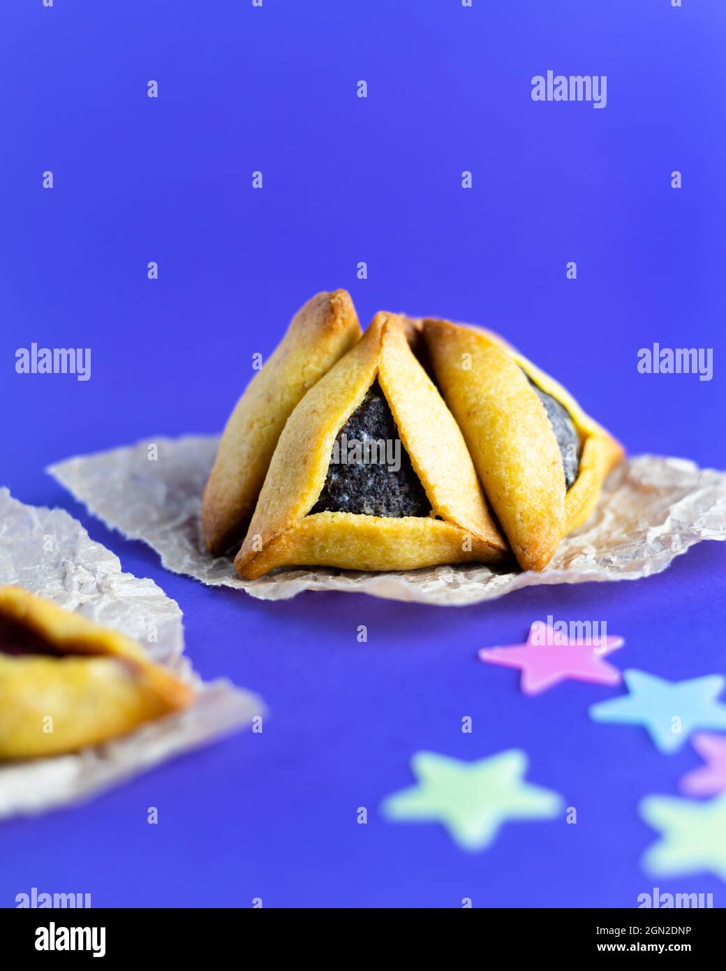 Traditional Jewish triangular hamantaschen cookies with poppy filling ...