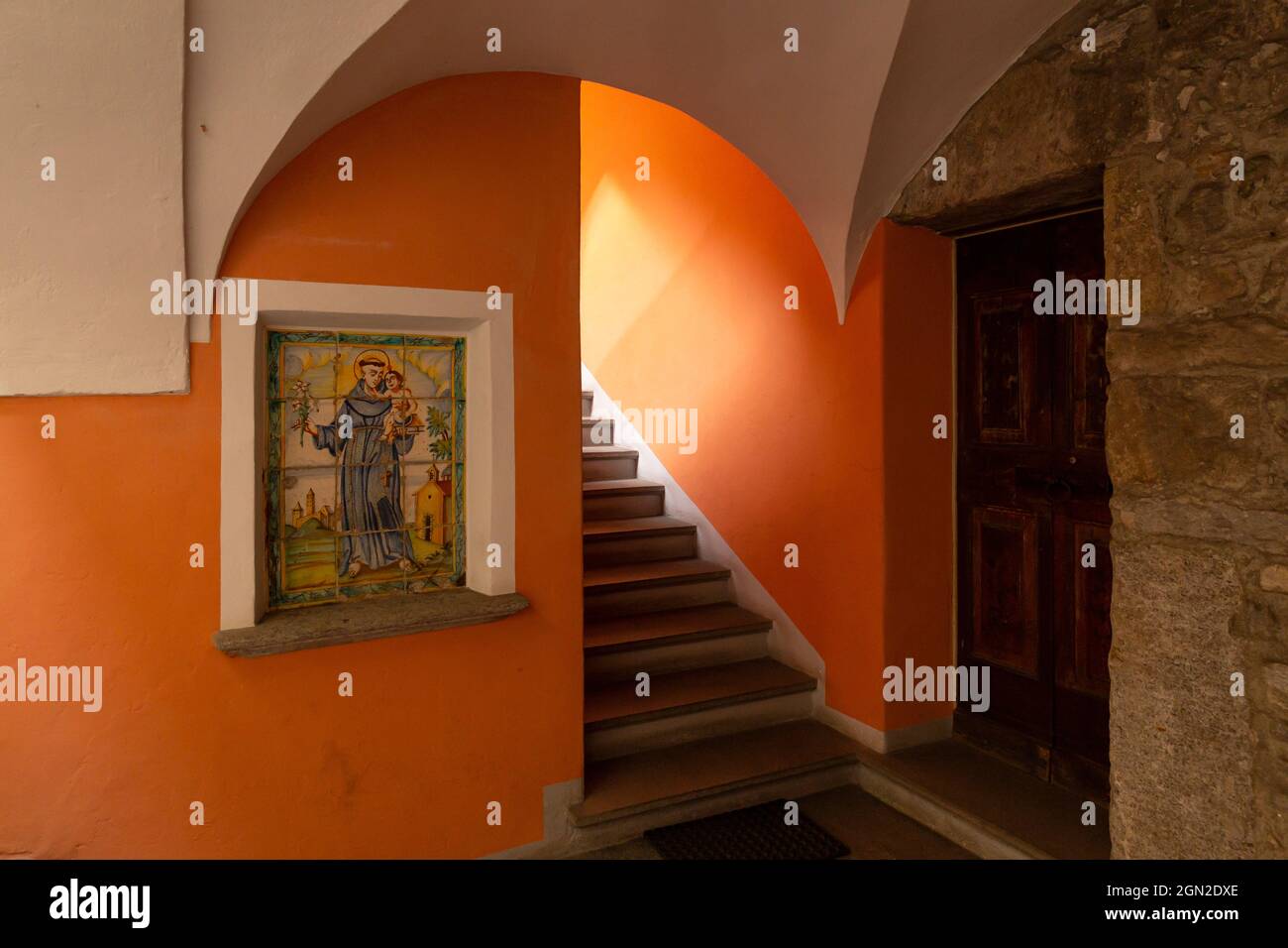 Switzerland, Locarno, 31 Aug 20. Orange painted vault with religious ...