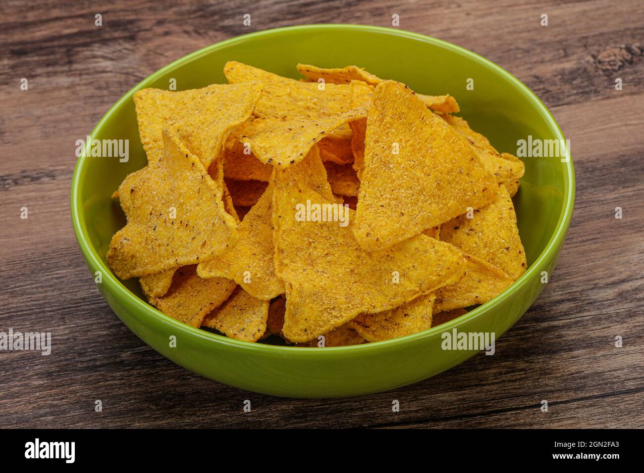 Mexican crunchy corn nachos triangle heap Stock Photo - Alamy