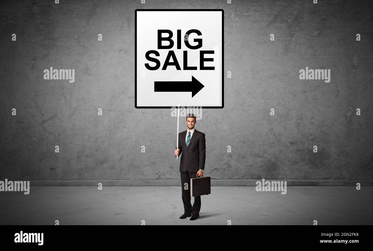 business person holding a traffic sign Stock Photo - Alamy