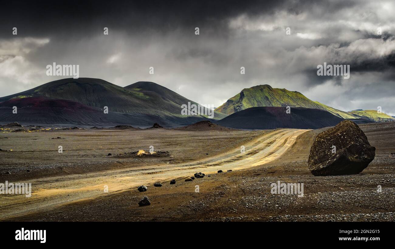 ICELAND, LANDMANNALAUGAR, A LANDMANNALAUGAR CROSSING ROAD WITH A LUNAR ...