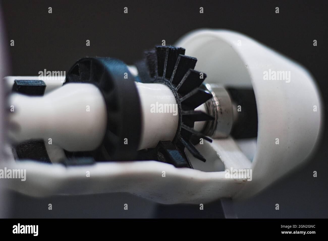 Closeup shot of an electric fan engine isolated on black background ...