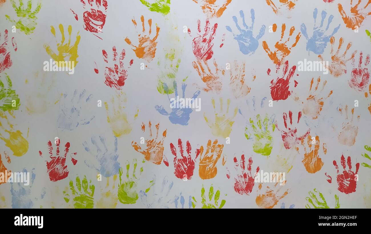 Colorful handprints on a wall Stock Photo - Alamy