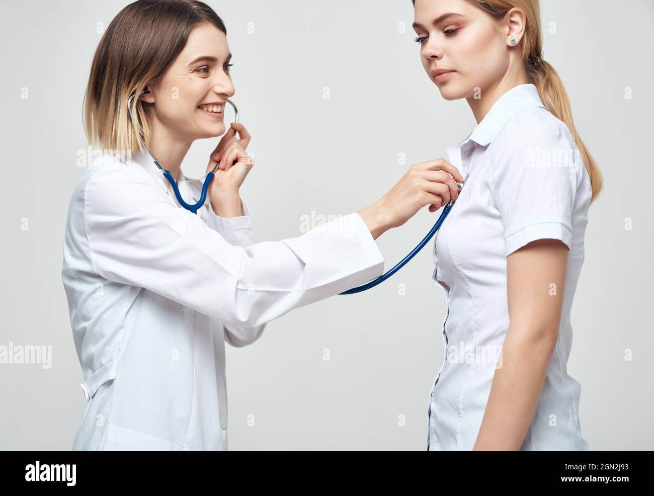 doctor patient examination health care light background Stock Photo - Alamy