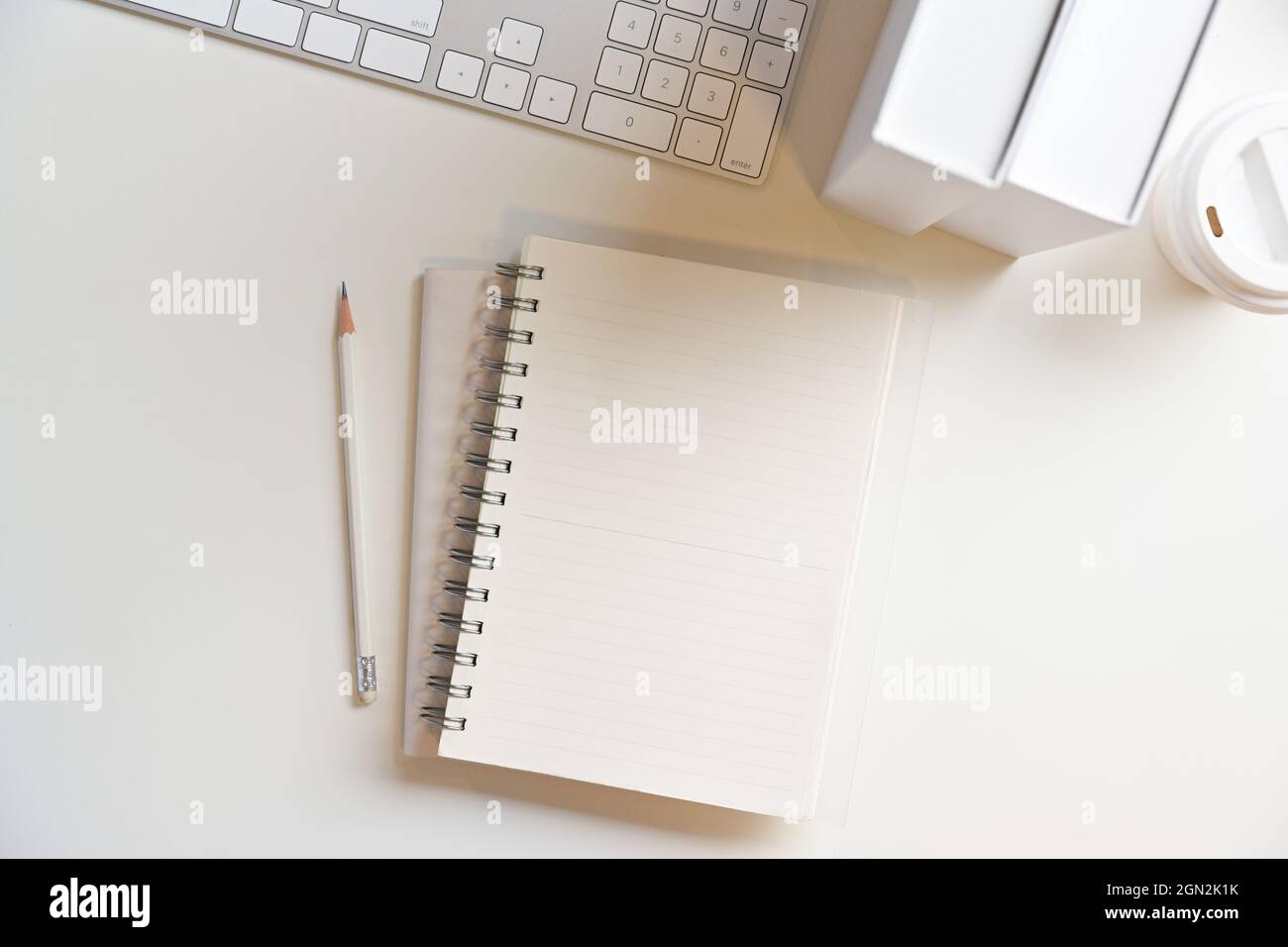 Closeup, Modern workspace with white background and blank pages on ...