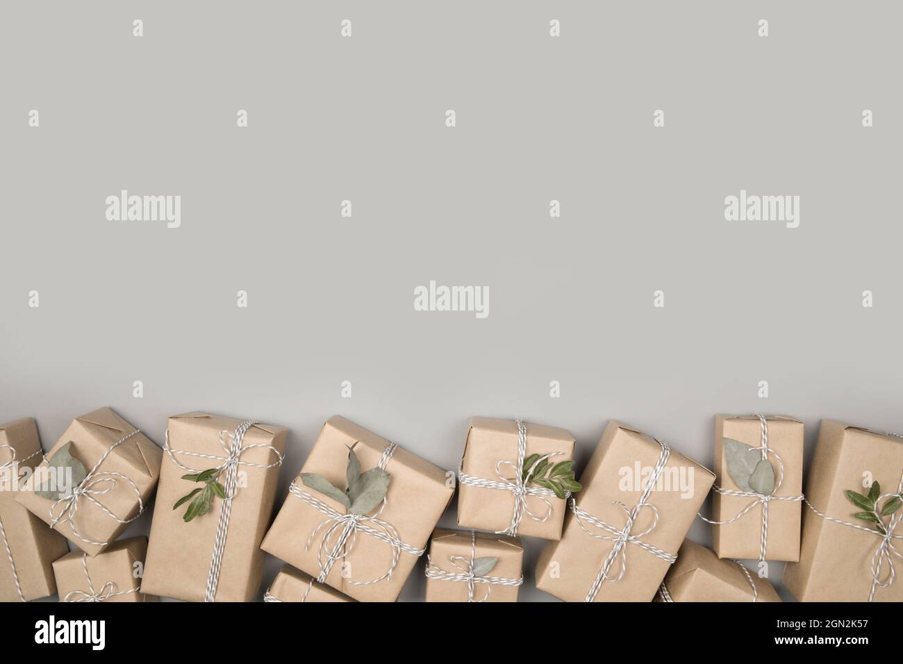 Small gift boxes on solid gray background Stock Photo - Alamy