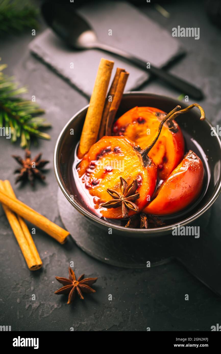 Christmas dessert - flamed tamarillo in hot wine punch with cinnamon ...