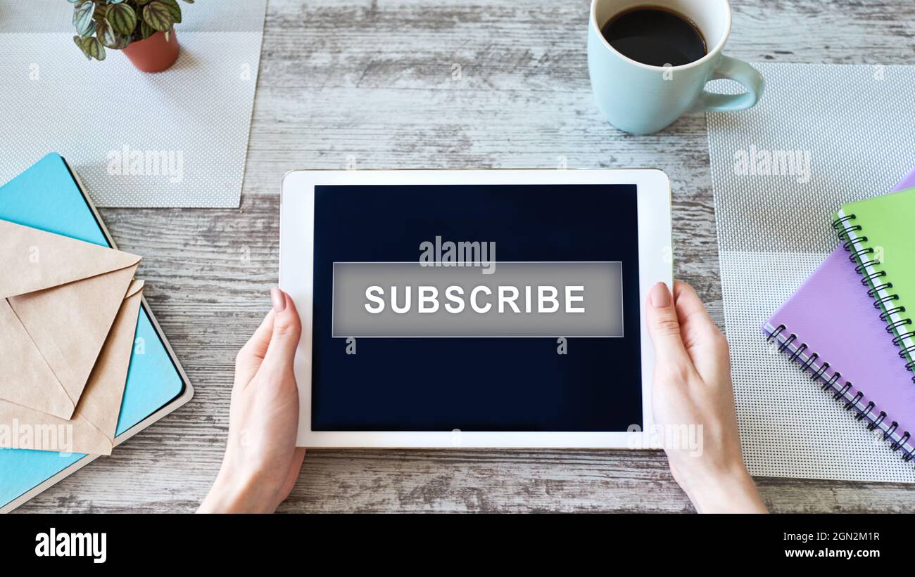 Subscribe button on device screen. Internet and digital marketing ...