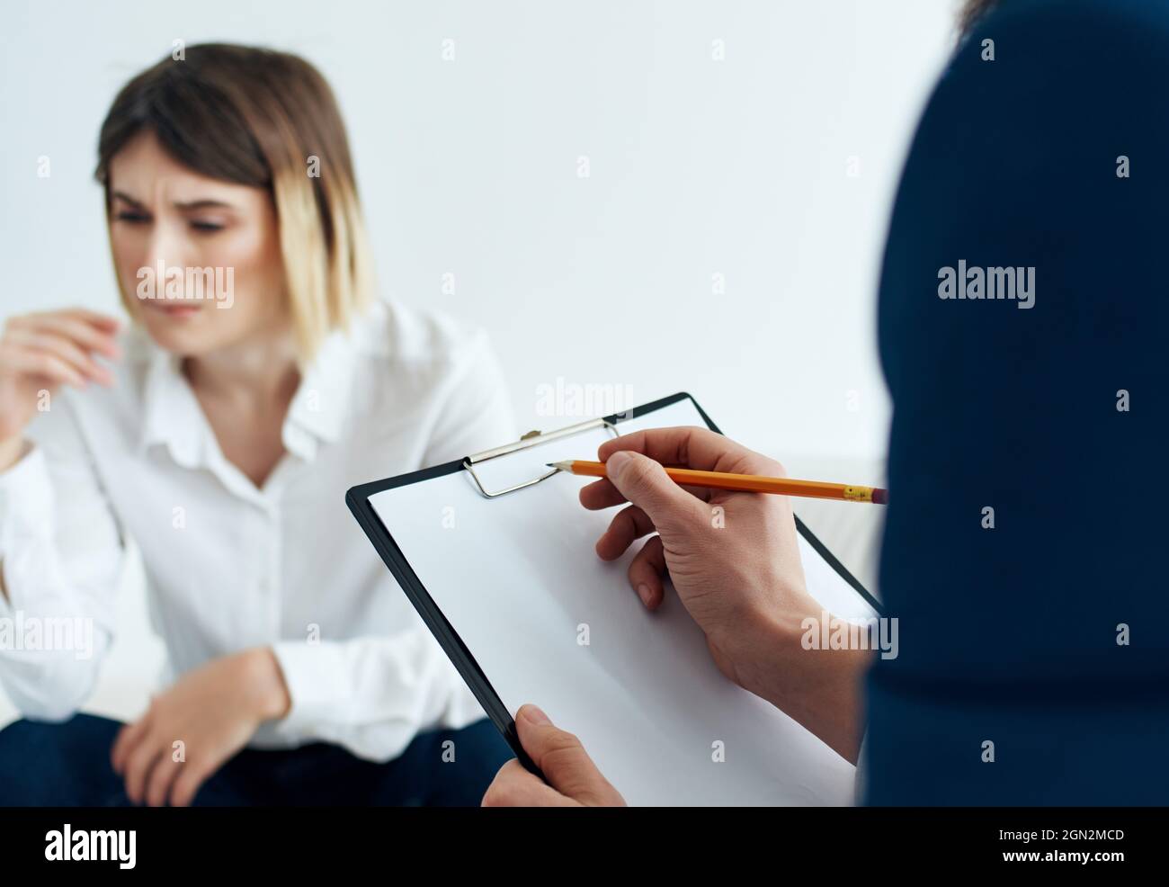 the patient sits with a psychologist psychotherapy communication stress ...