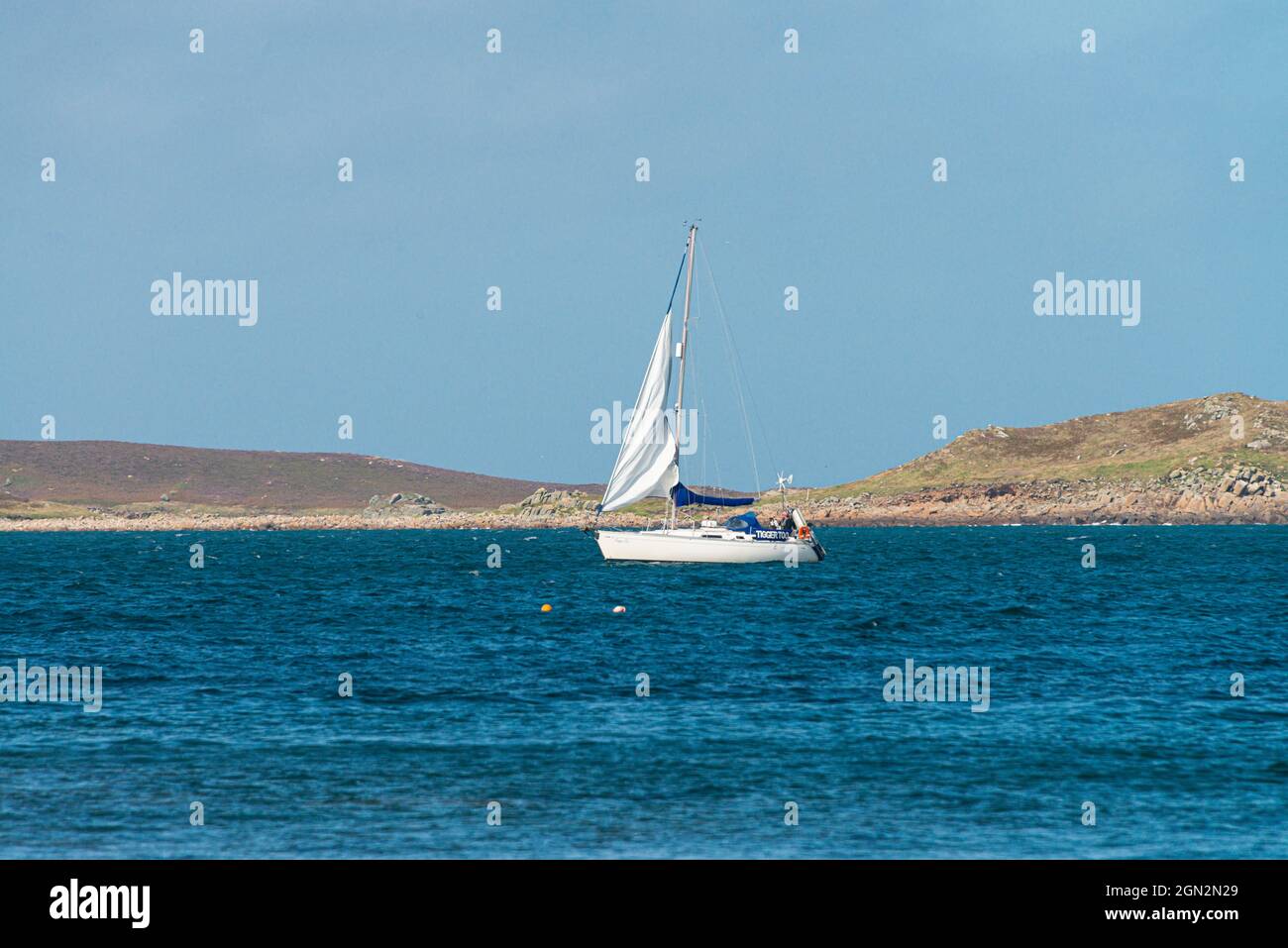 A boat sailing off the coast of St Mary's, Isles of Scilly Stock Photo ...