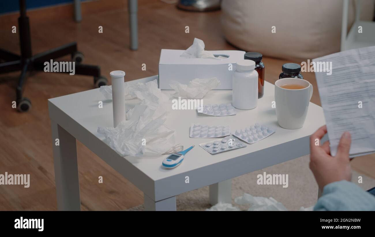 Close up of table with bottles of pills and capsules with tablets while ...