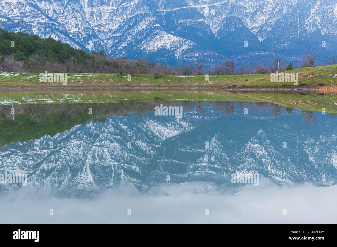 Mountains snow lake with reflection. Mogaba reservoir with mountain ...