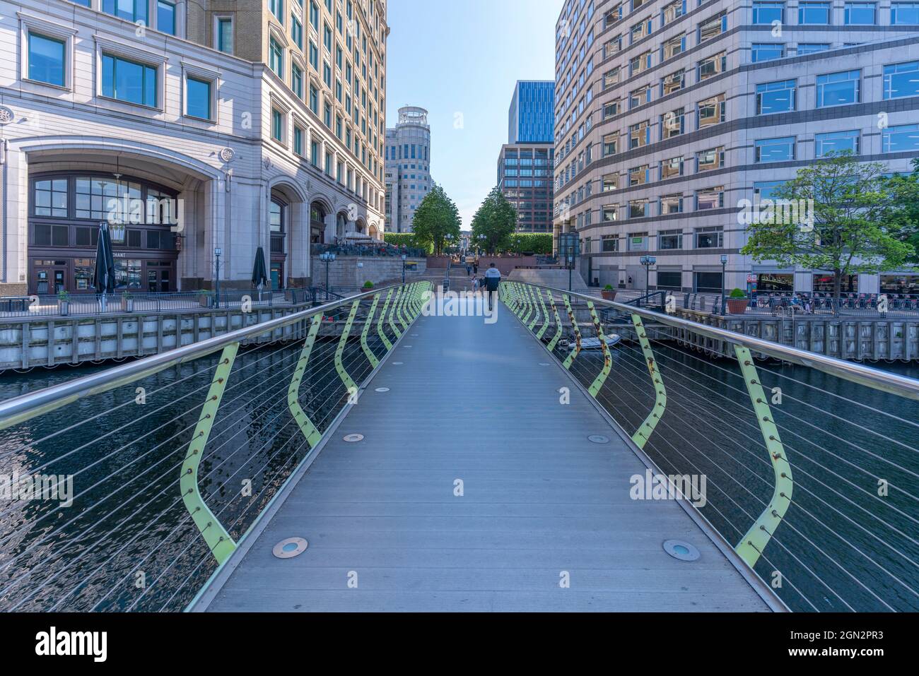 View of pedestrian walk bridge in Canary Wharf, Docklands, London ...