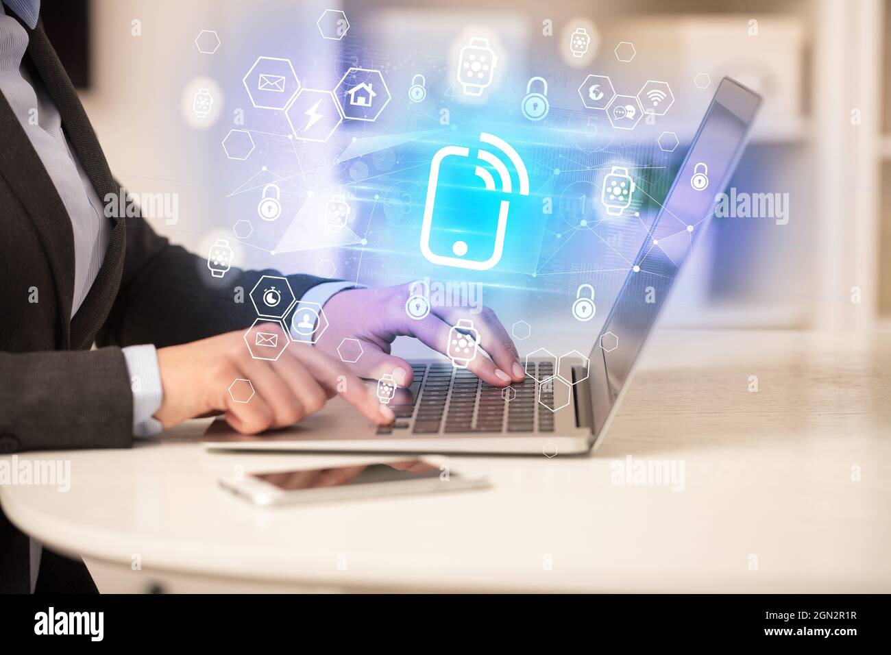 Hands working on laptop with digital icons Stock Photo - Alamy