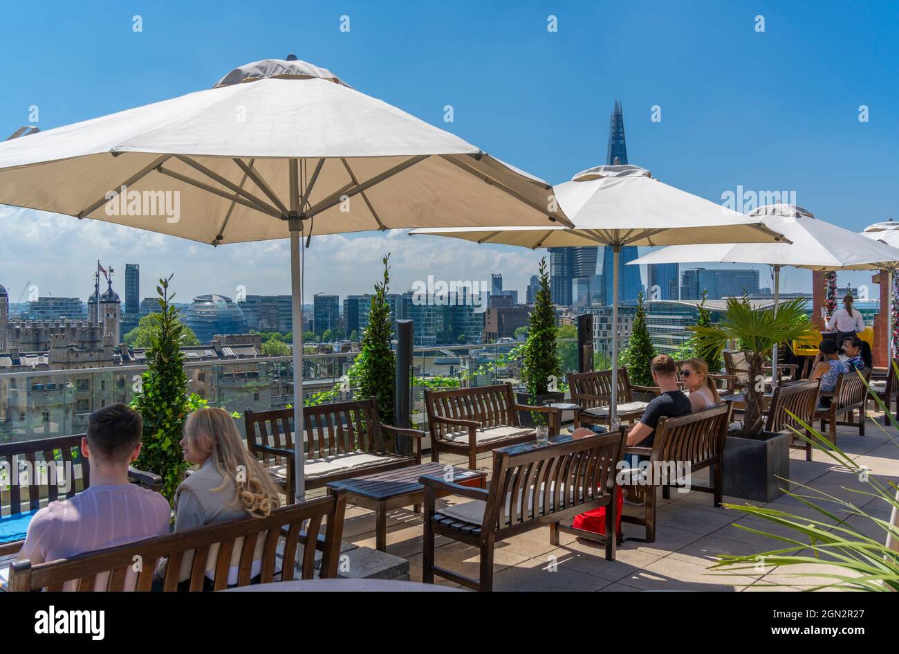View of the Shard and Tower of London from rooftop bar, London, England ...