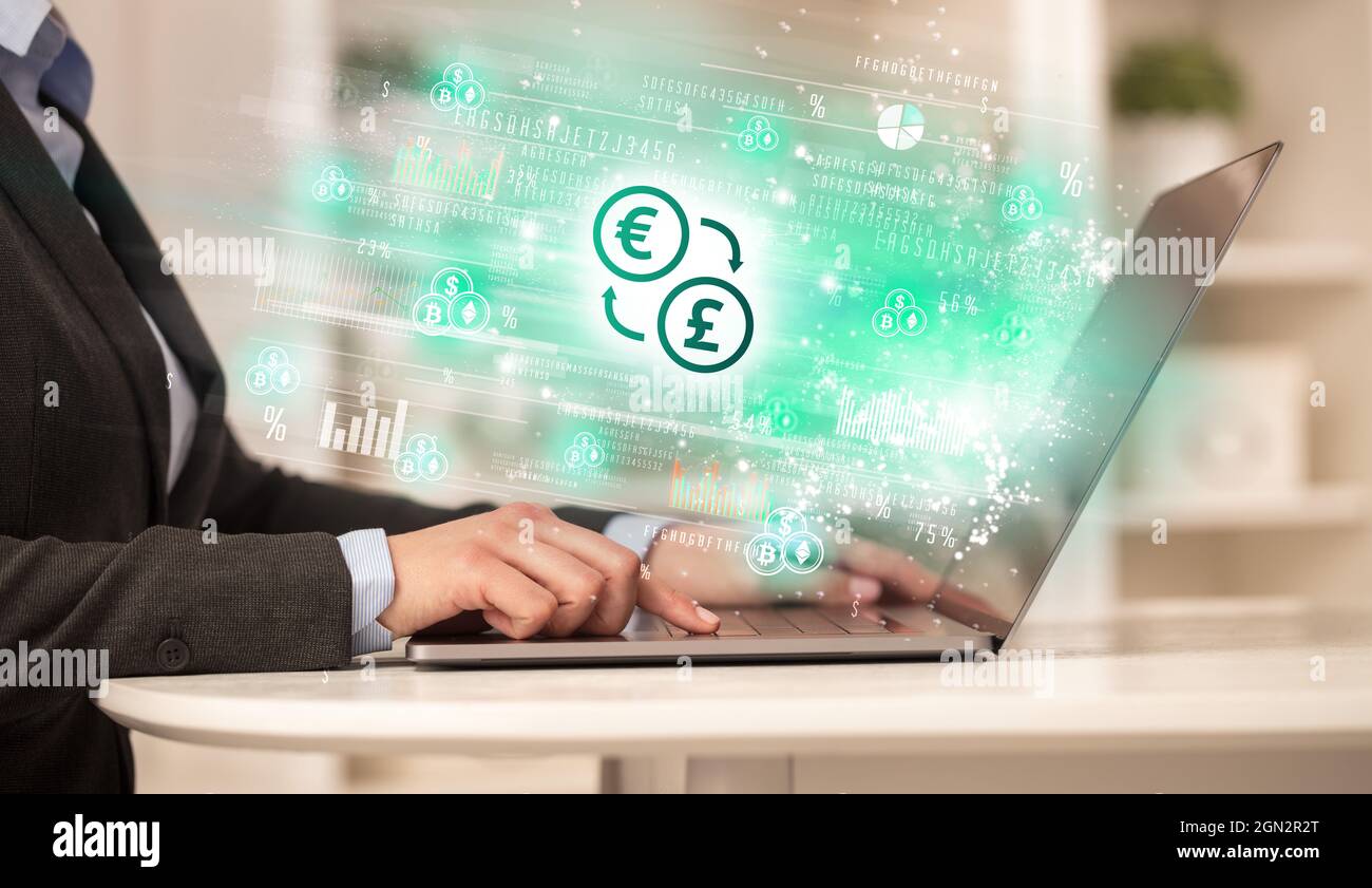 Young man watching stock market on laptop Stock Photo - Alamy