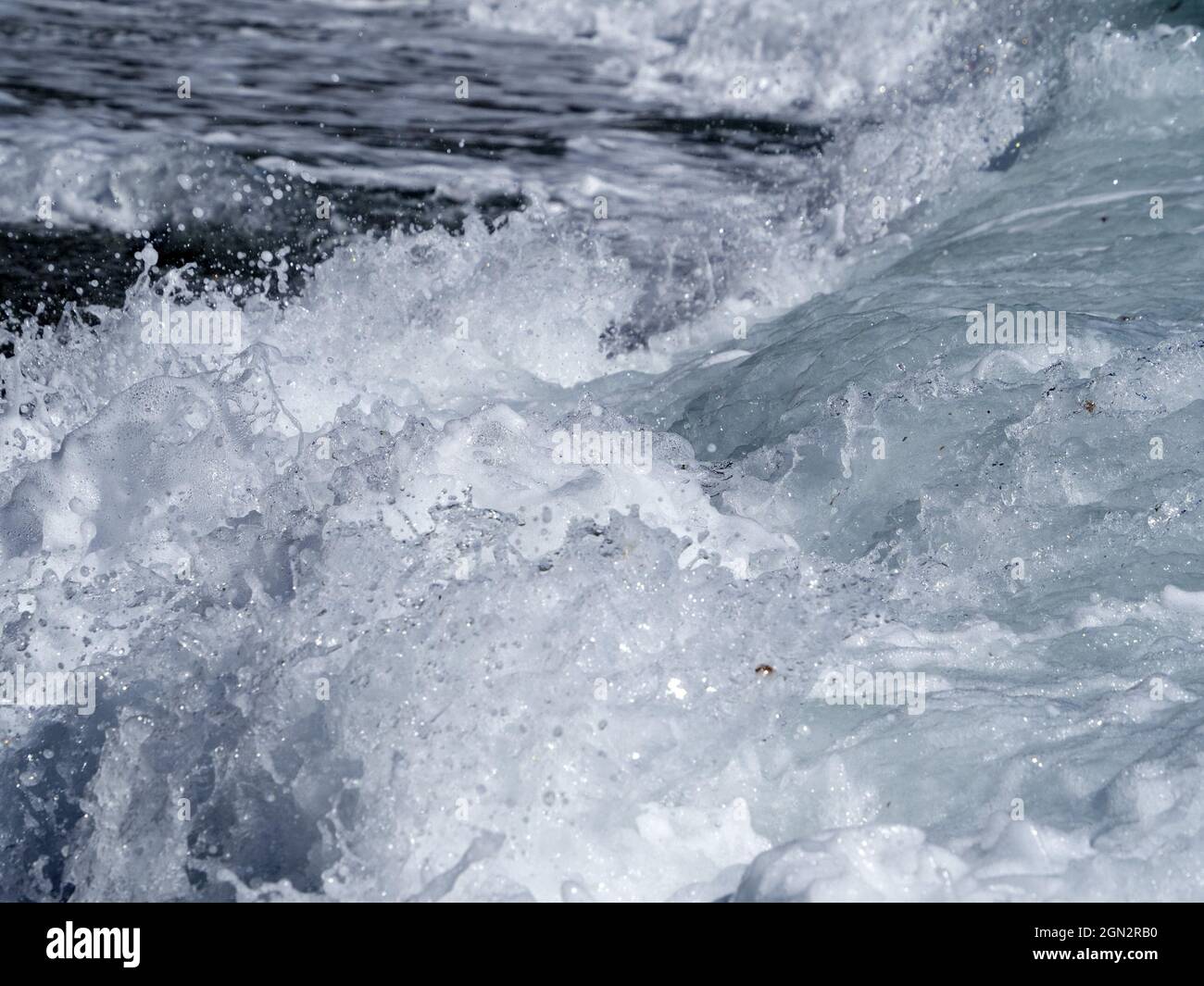 Sea wave on the shore detail Stock Photo - Alamy