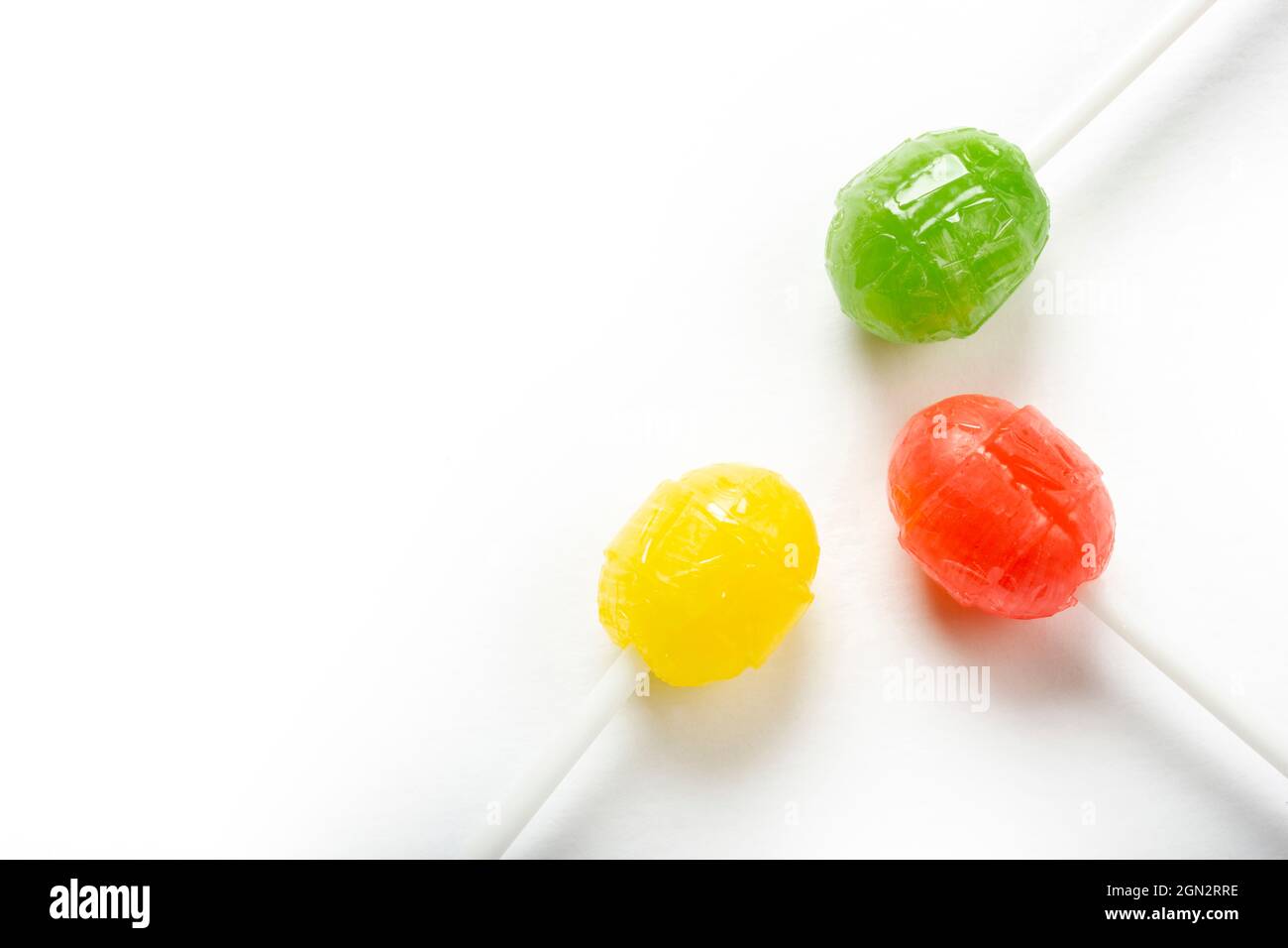 Three delicious lollipops isolated on white Stock Photo - Alamy