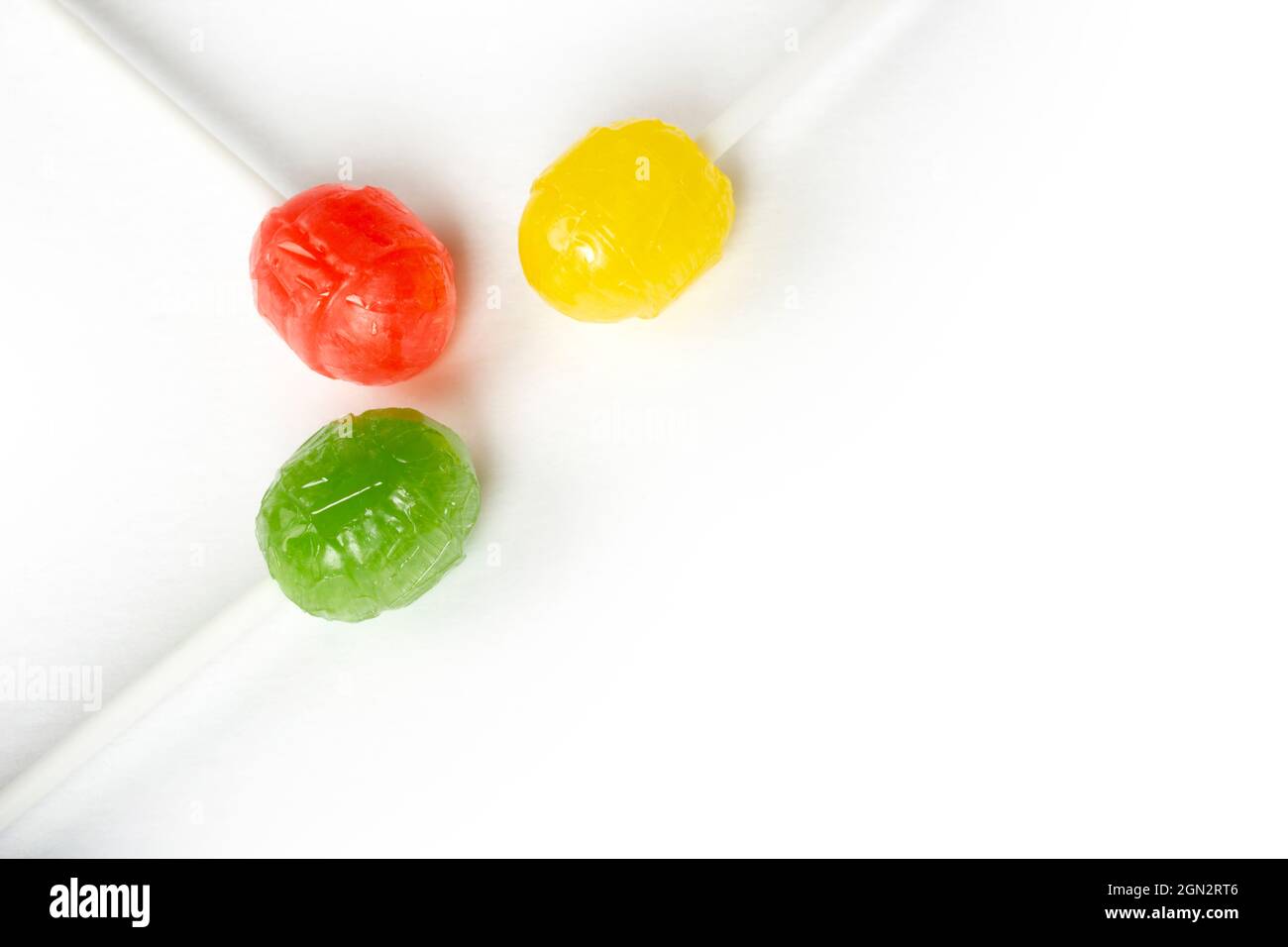 Three delicious lollipops isolated on white Stock Photo - Alamy
