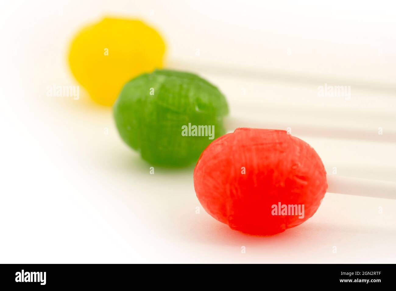 Three delicious lollipops isolated on white Stock Photo - Alamy