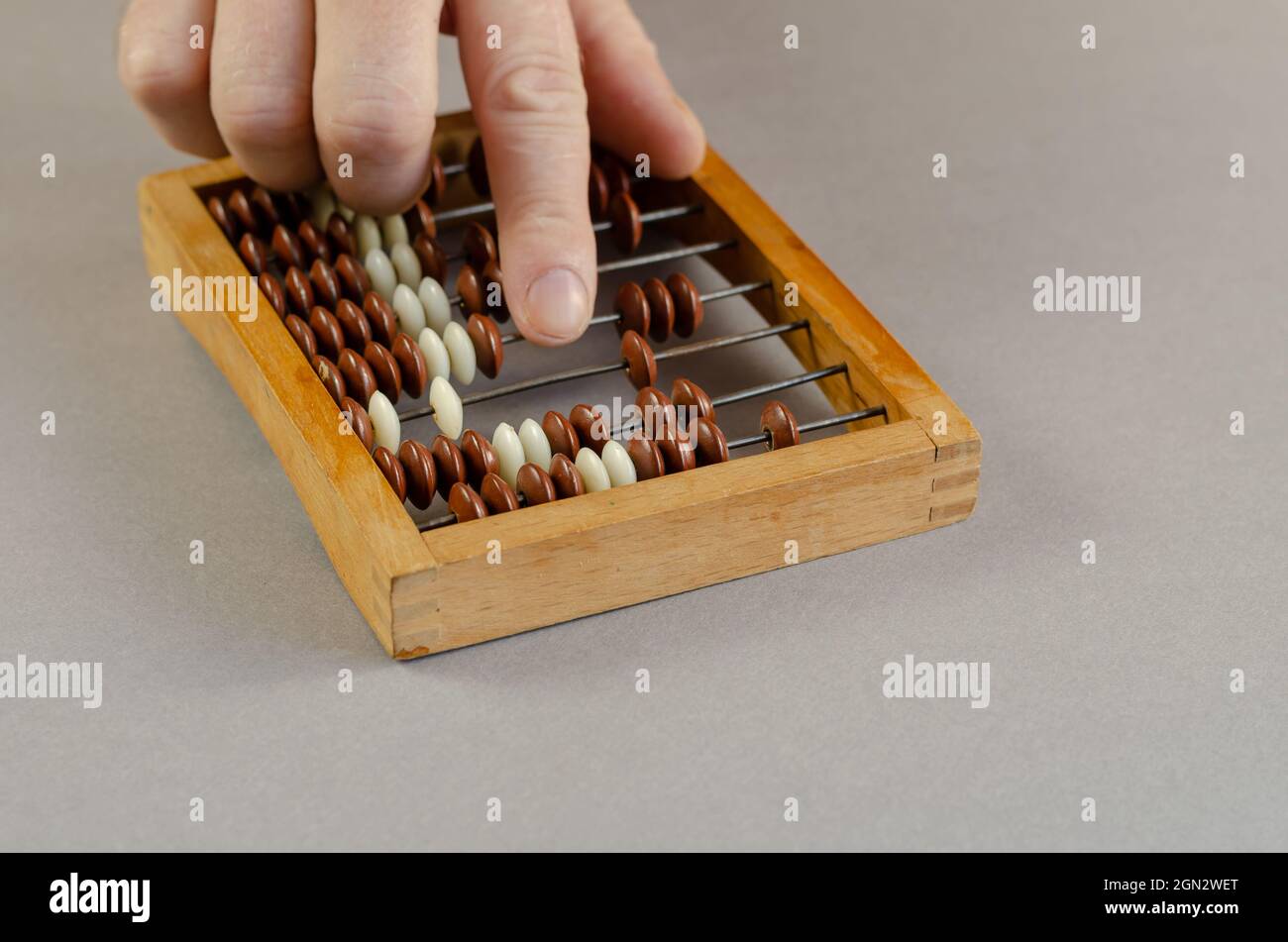 Right hand of an adult male performs mathematical calculations o Stock ...
