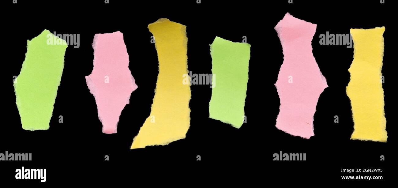Color torn paper on black background Stock Photo - Alamy