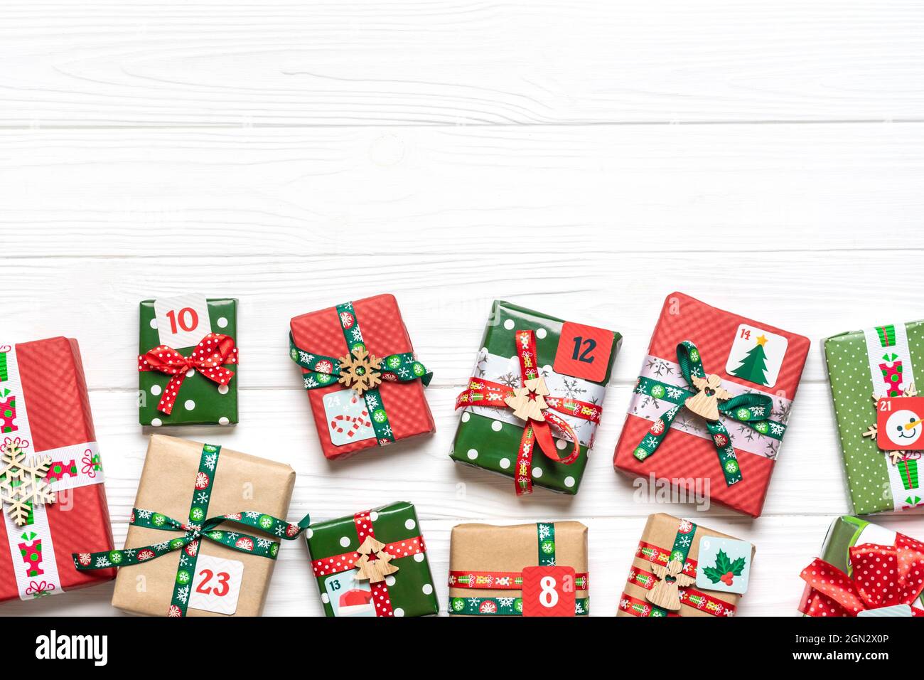 Handmade wrapped red, green gift boxes decorated with ribbons ...