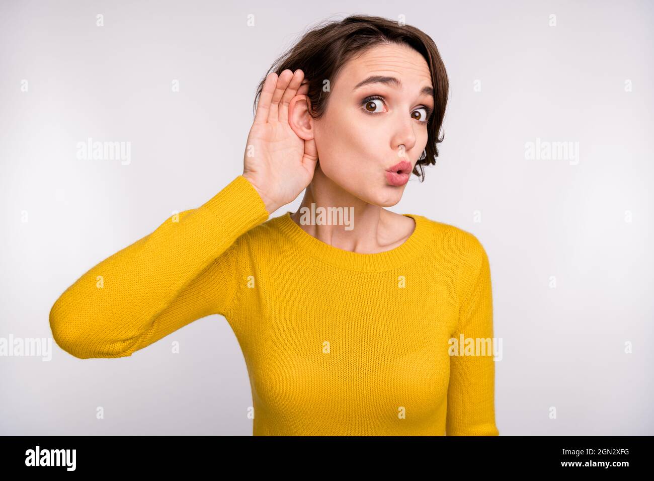 Photo of shocked gossip girl hands ear eavesdropping wear yellow shirt ...
