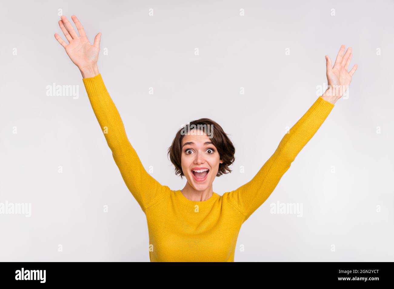 Photo of young cheerful woman happy positive smile hands up wave ...