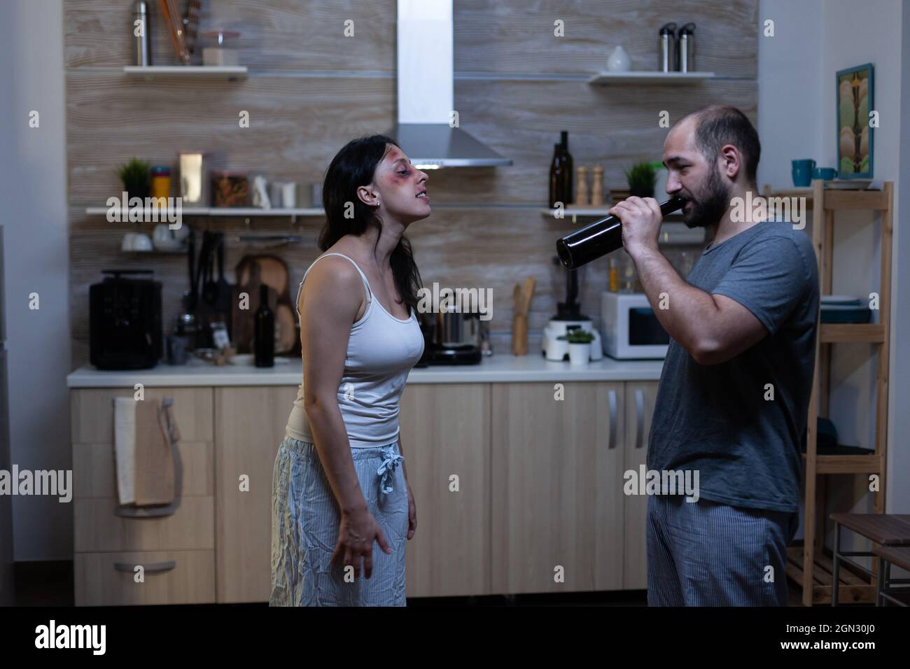 Couple fighting over alcohol addiction and aggression. Abused woman ...