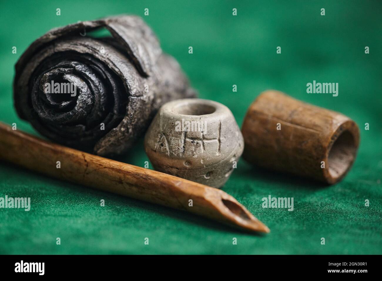 Ancient writing. Birch bark manuscript, bone stylos, clay spindle whorl ...