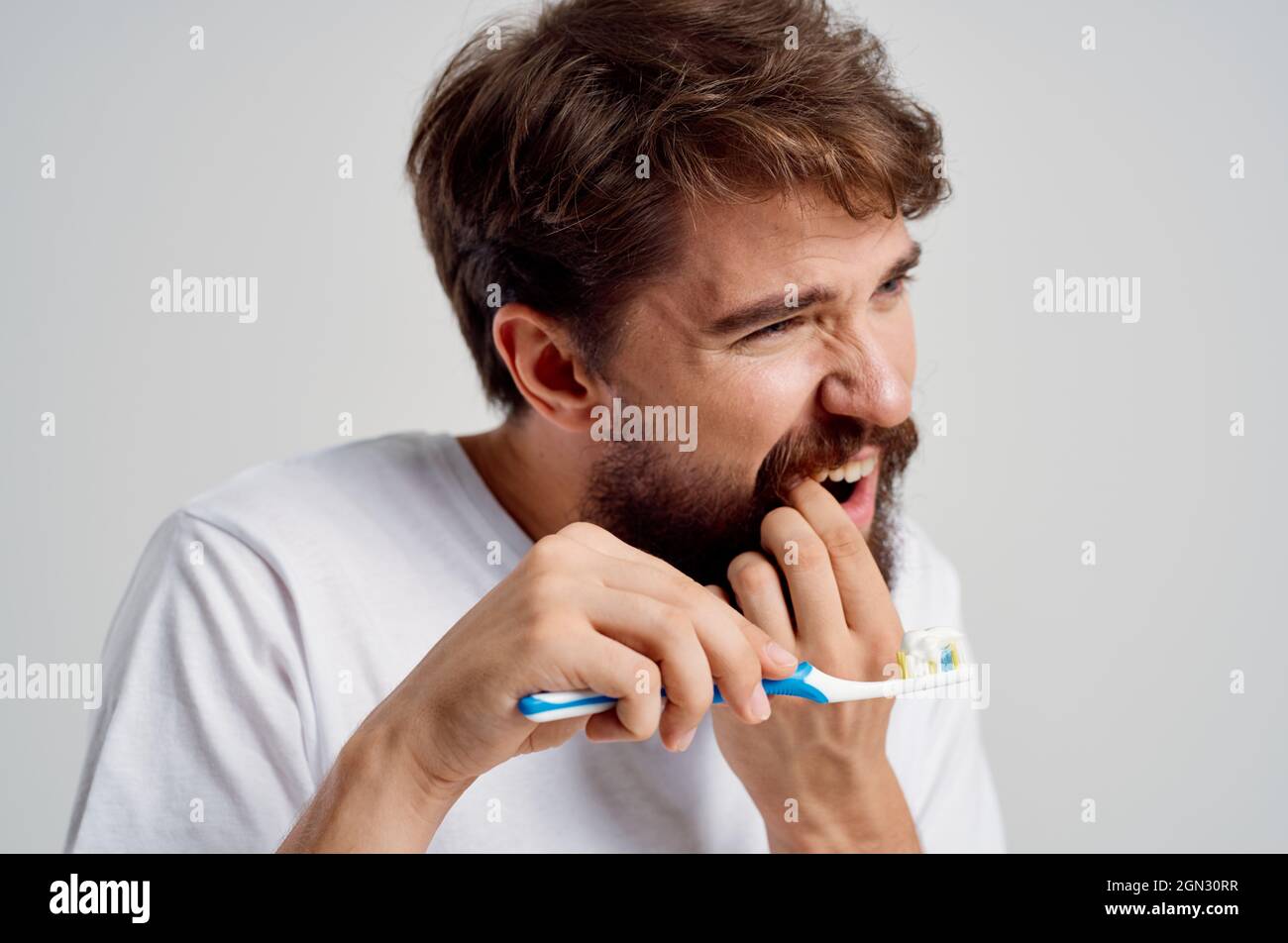 man hygiene toothpaste morning isolated background Stock Photo - Alamy