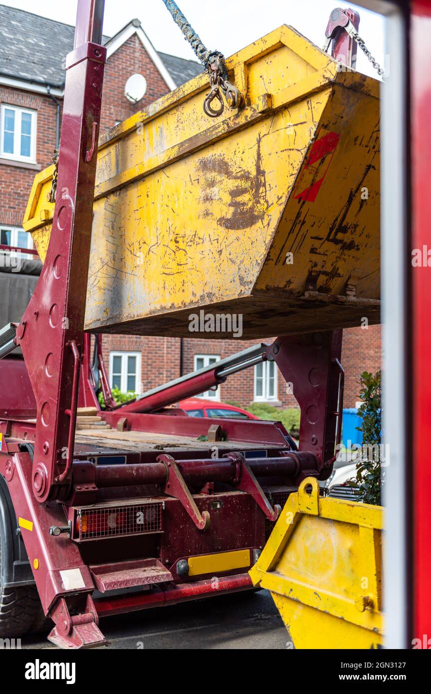 Big Yellow rubbish skip Stock Photo - Alamy