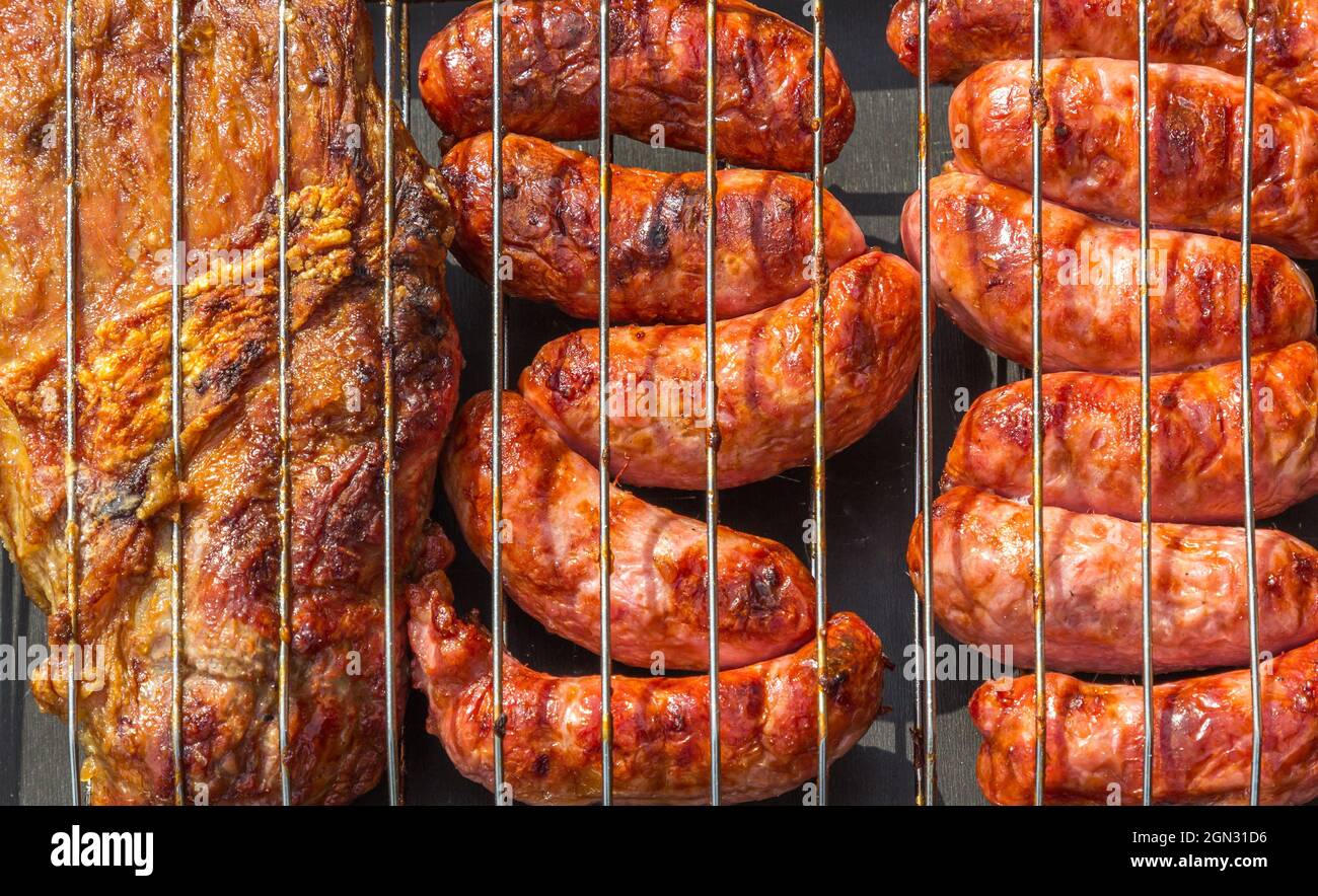 Delicious barbecue of meat and sausages Stock Photo - Alamy