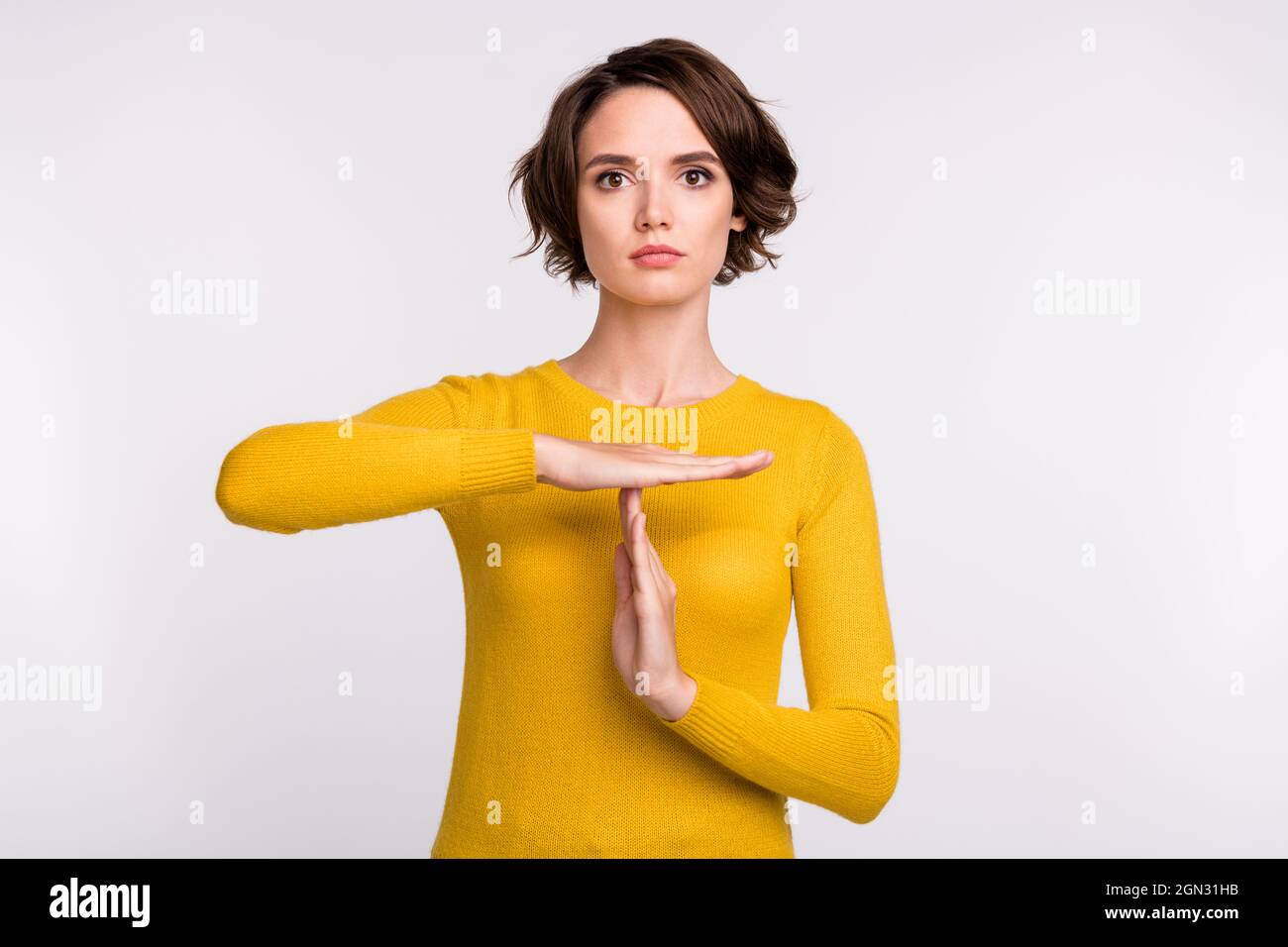 Photo of young woman show hands ban block restriction rule limit ...