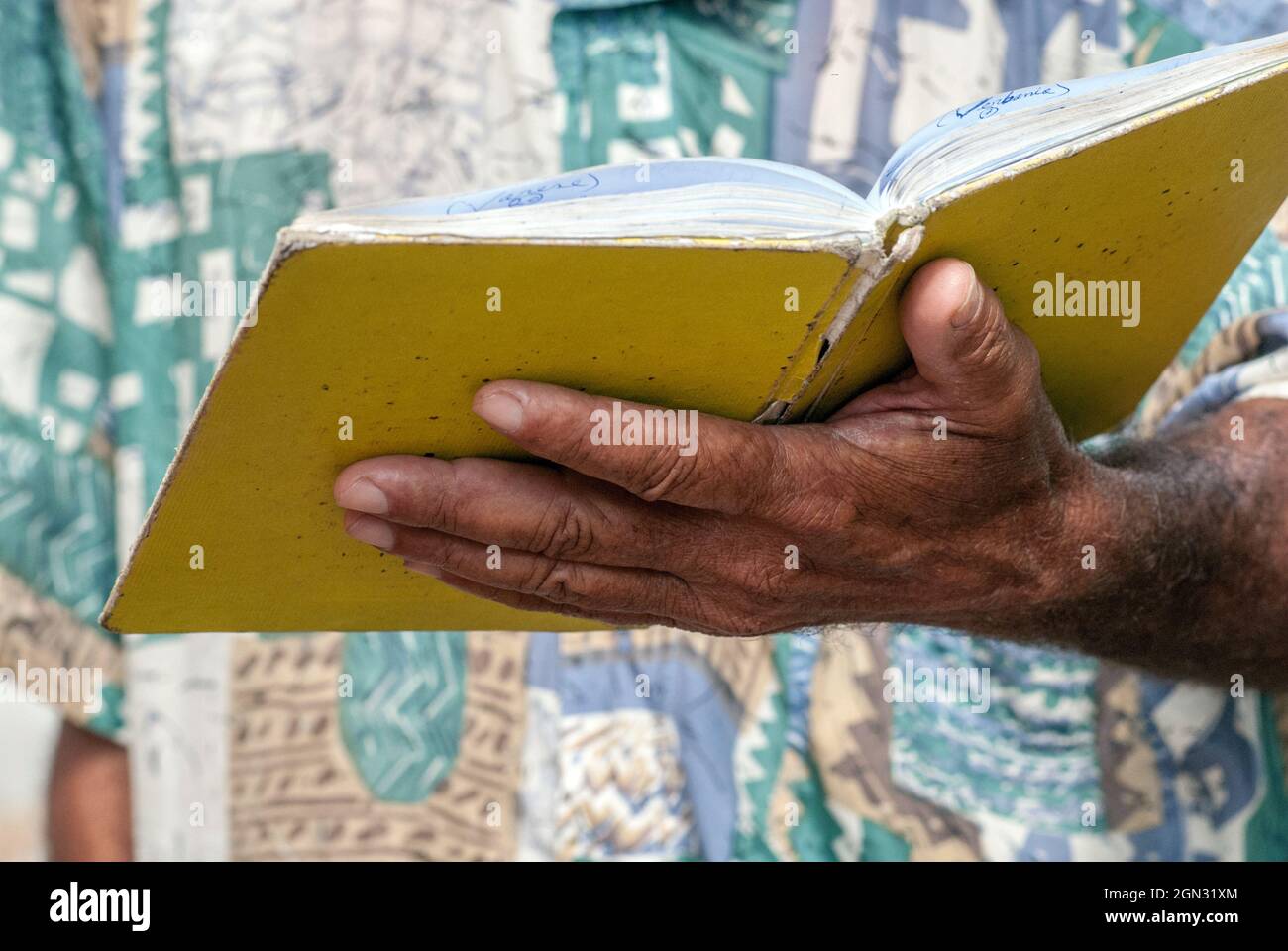 man holding a book, man reading a book, man reading poetry Stock Photo ...