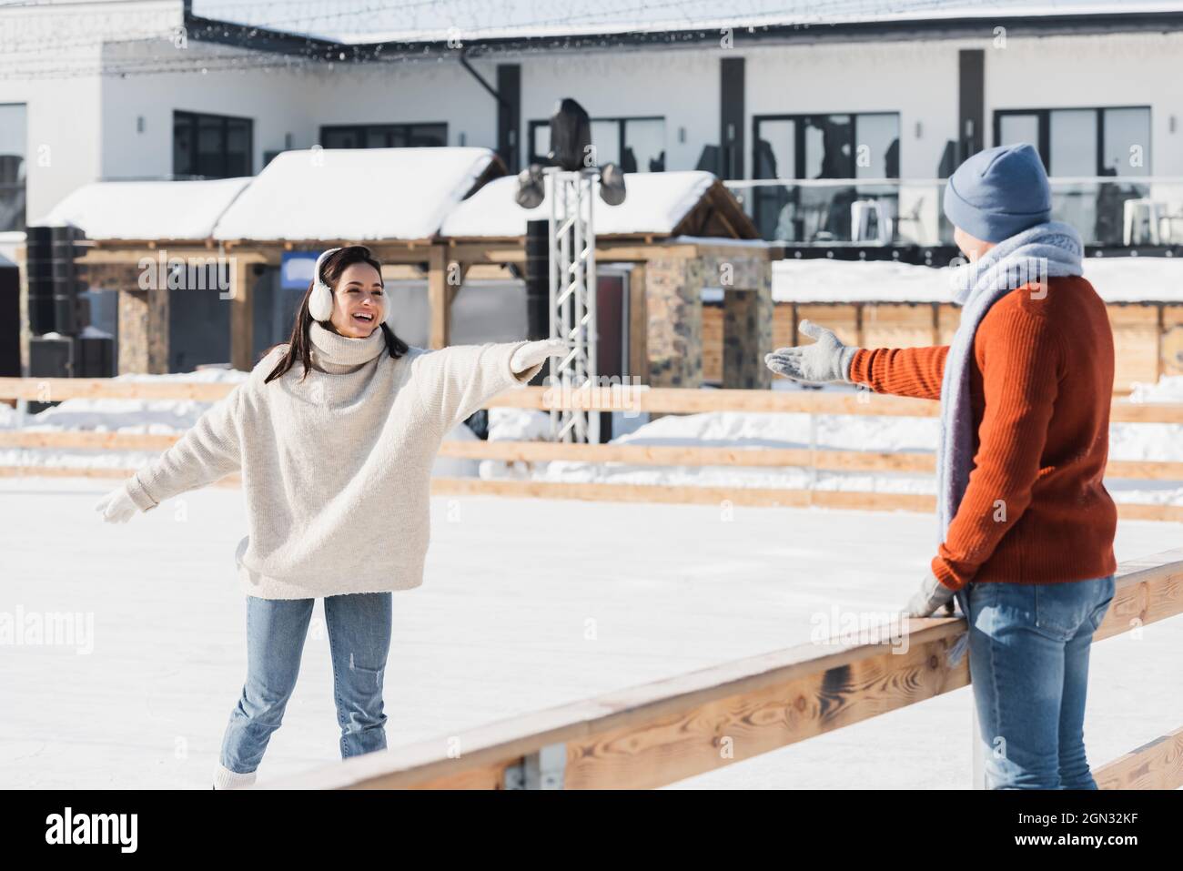 Young couple skates hand hi-res stock photography and images - Alamy